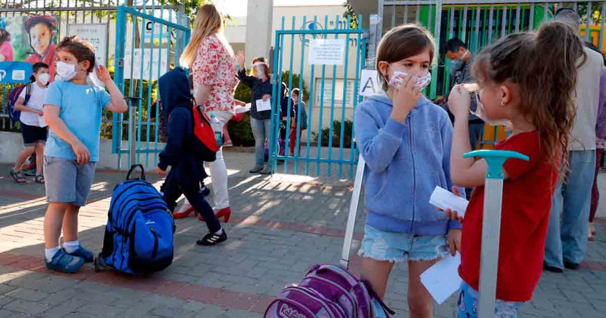 Britain reopens schools prompting ferocious debate